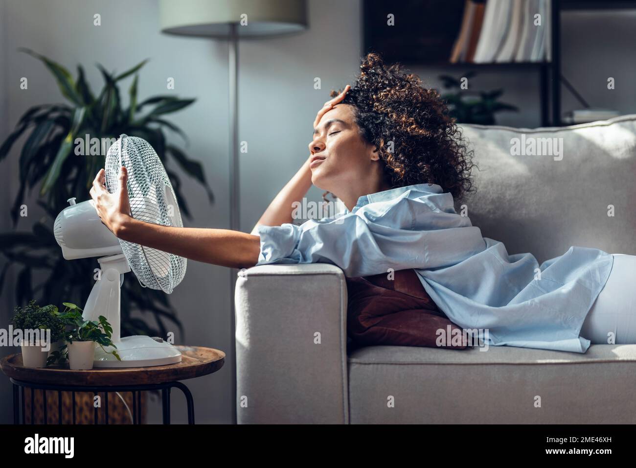 Woman cooling fan hi-res stock photography and images - Alamy