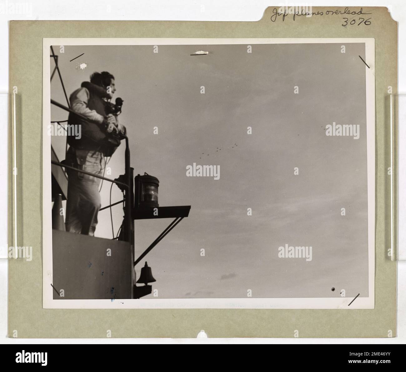 A Coast Guard lookout aboard a landing ship (LST) spots fifteen ...