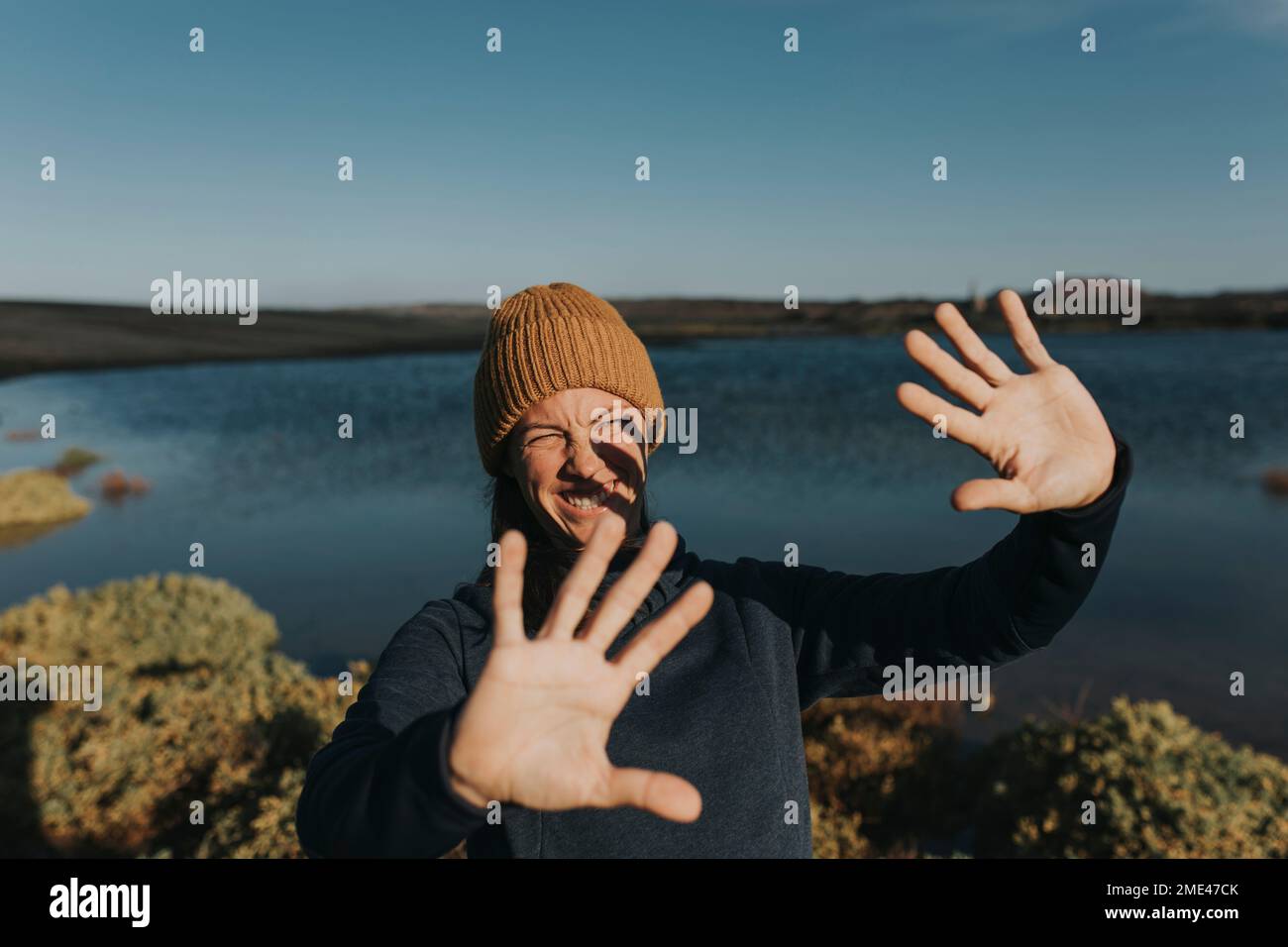Woman shielding eyes from light hi-res stock photography and images - Alamy