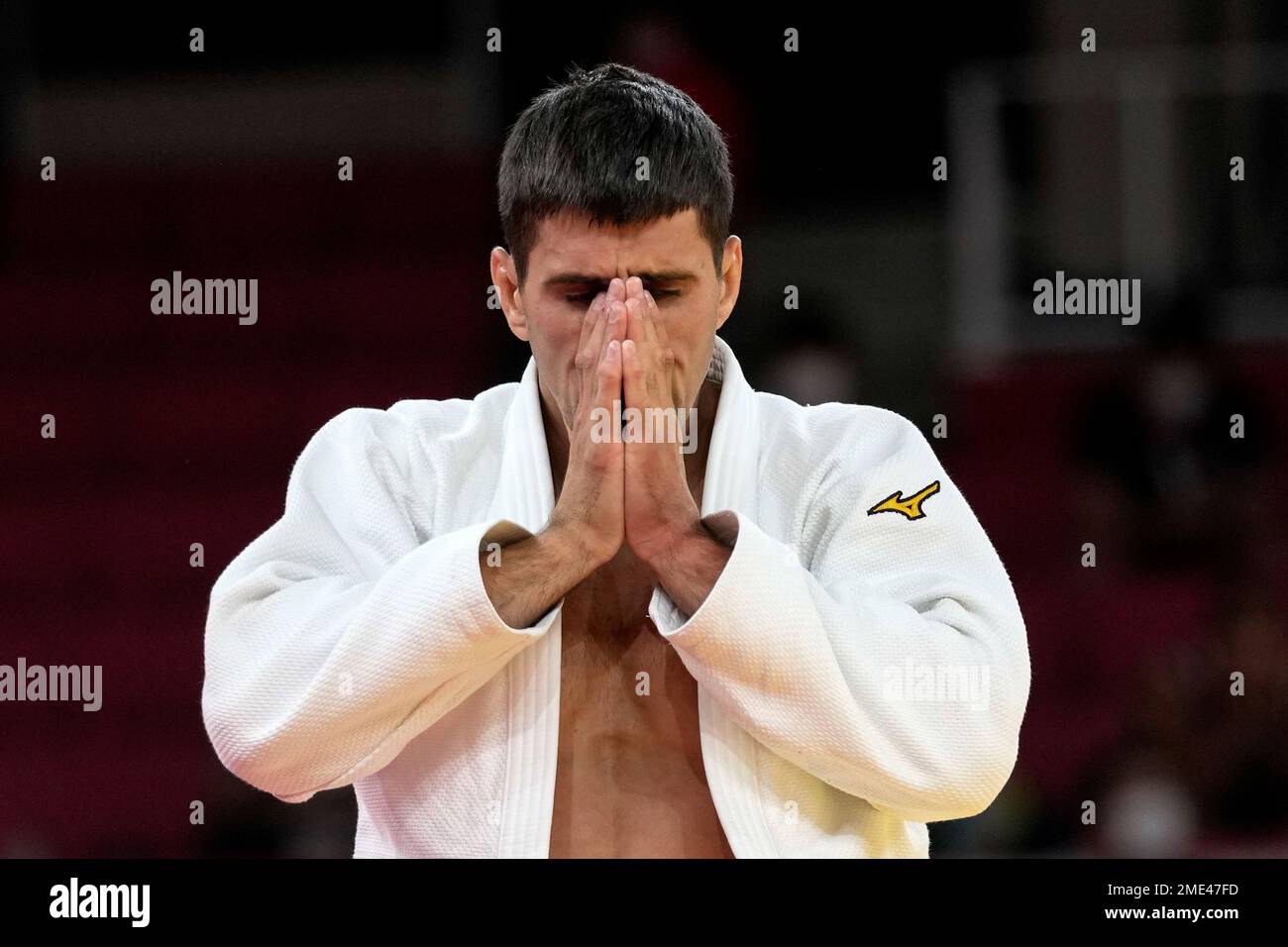 Rustam Orujov of Azerbaijan reacts after defecting An Changrim of South Korea in the men's -73kg ...