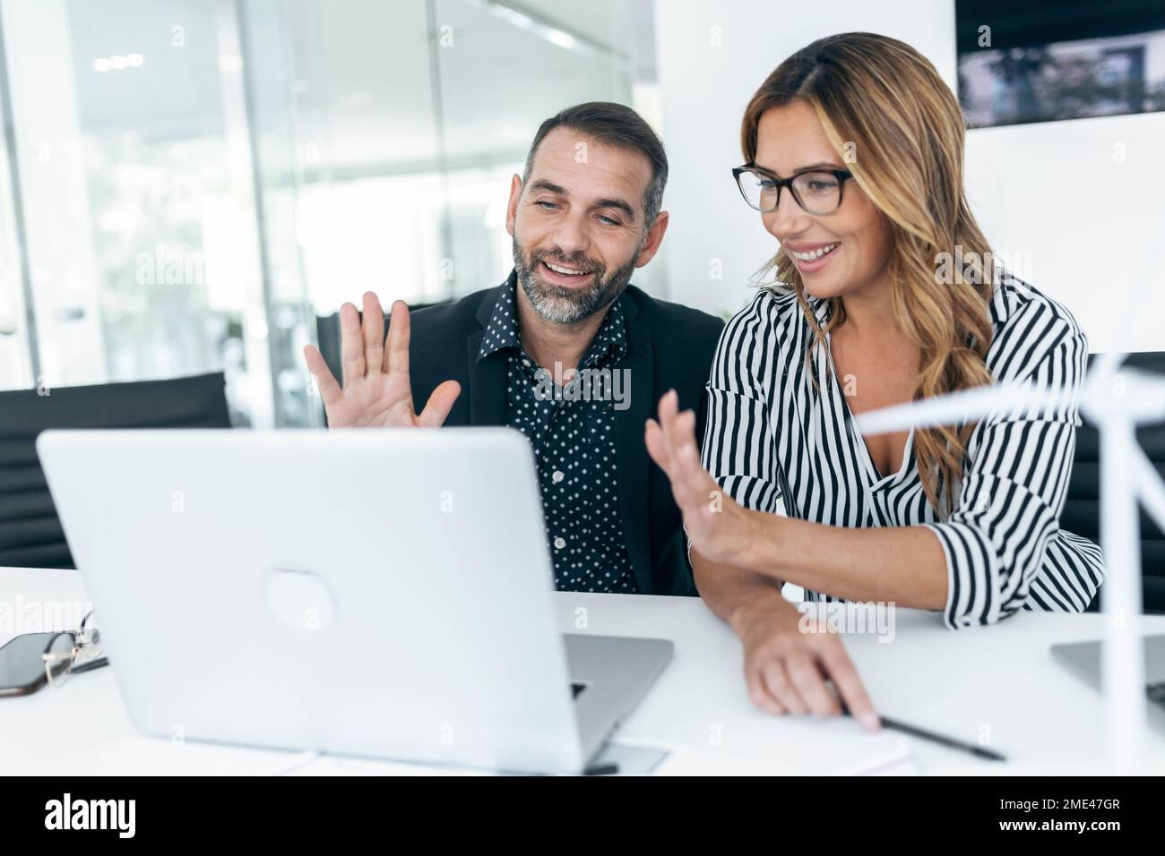 Happy office people waving hi-res stock photography and images - Alamy