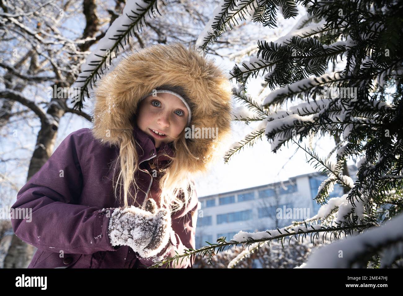Girl standing under tree hi-res stock photography and images - Alamy