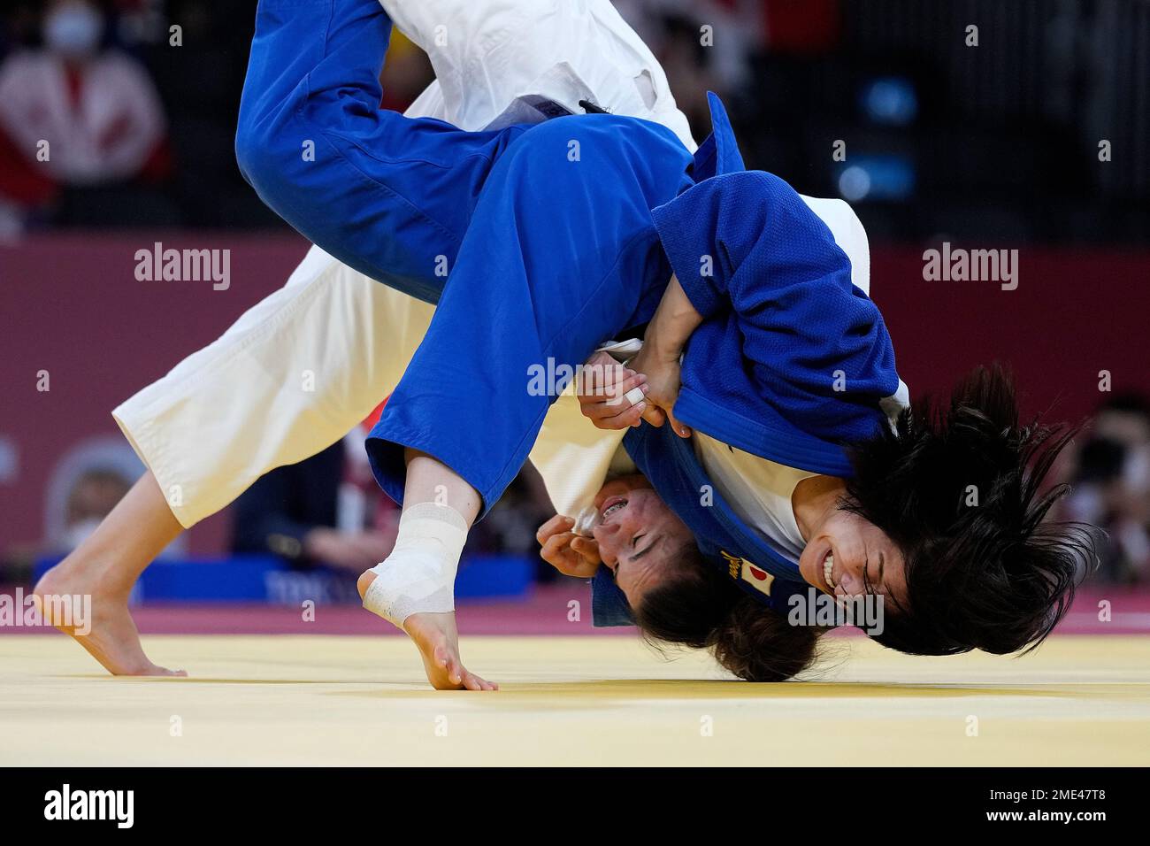 Tsukasa Yoshida of Japan and Eteri Liparteliani of Georgia compete ...