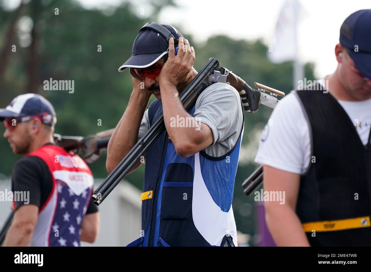 Abdullah Alrashidi, of Kuwait, reacts as he competes in the men's skeet ...