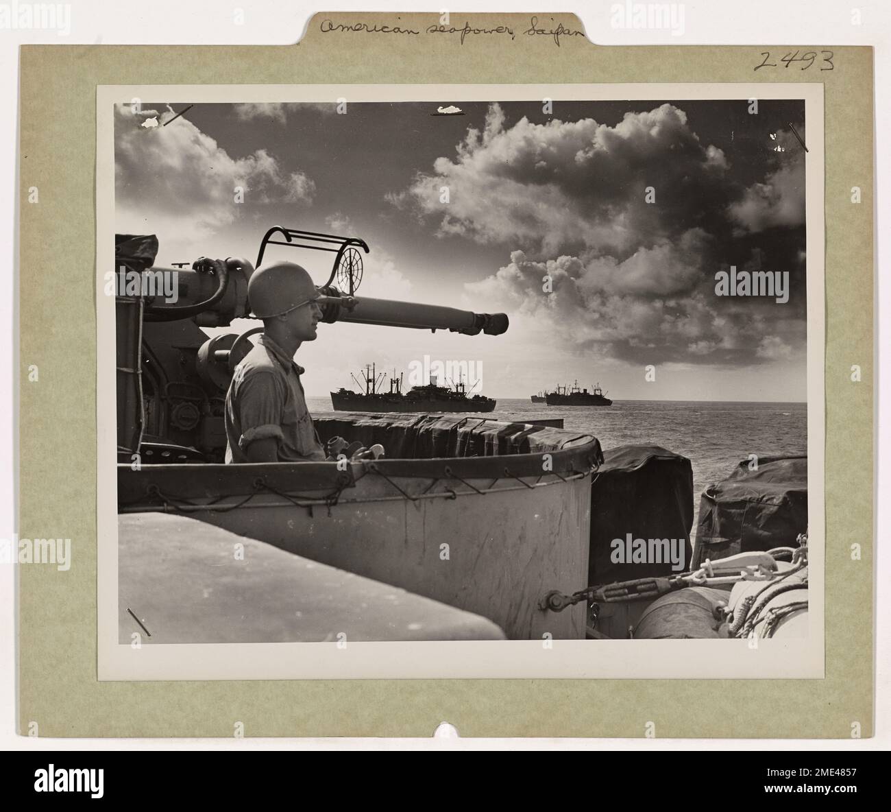 American Seapower Closes Vise on Saipan. A Coast Guard gunner is his ...
