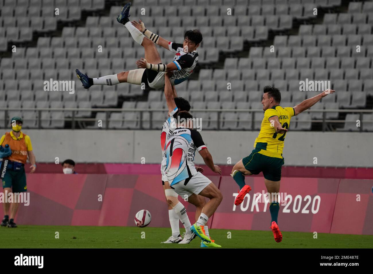South Korea's Jeong Yeon-sik is lifted in the air by teammate Lee Jink ...