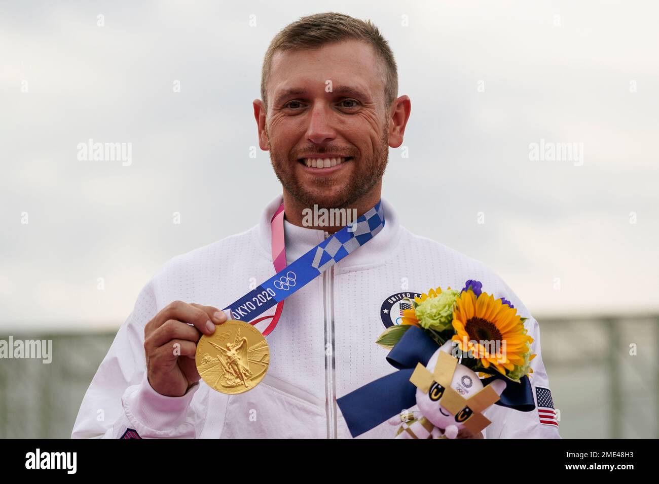 Vincent Hancock, of the United States, celebrates with his gold medal ...
