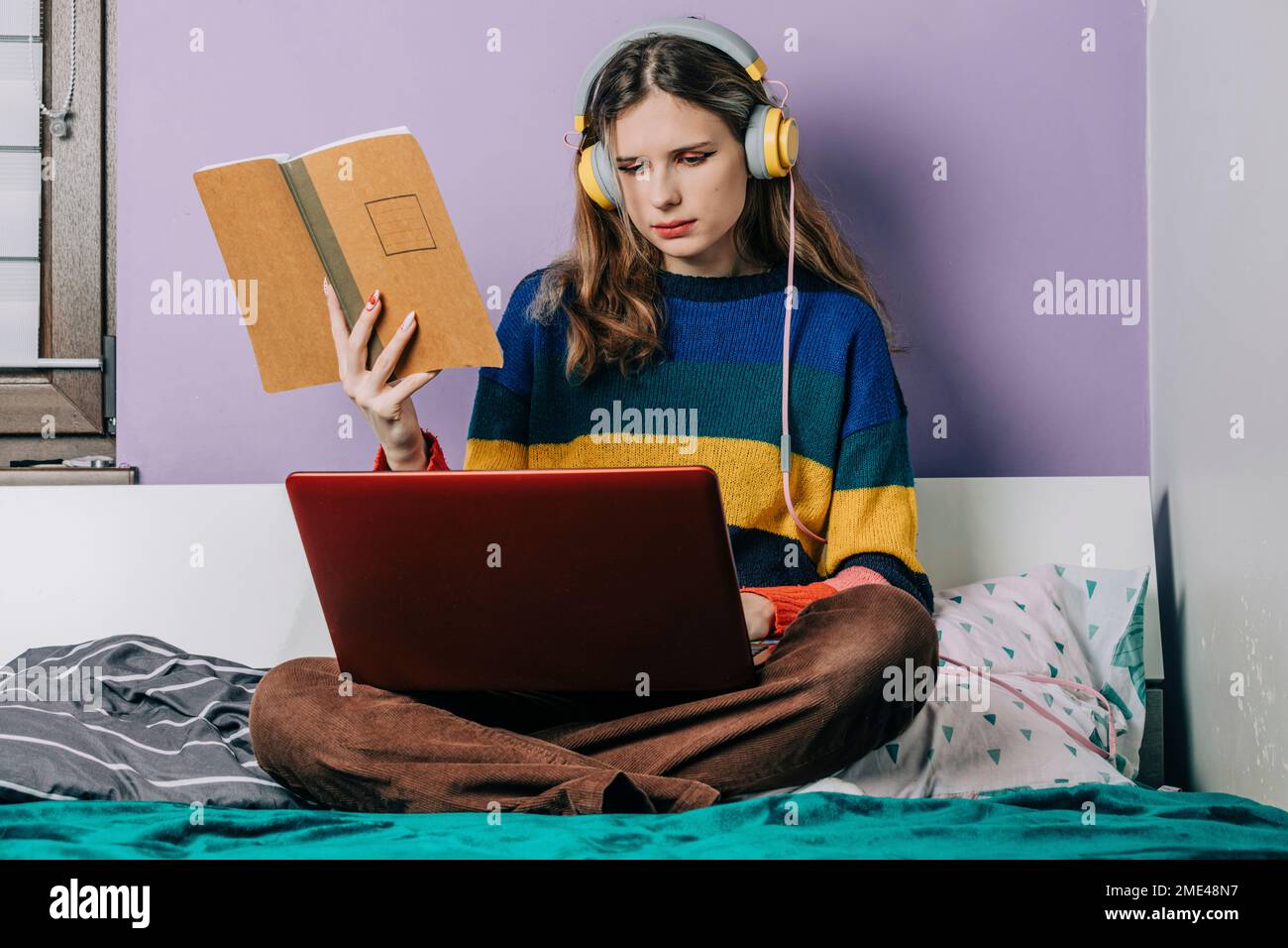 Homework laptop on her bed hi-res stock photography and images - Alamy