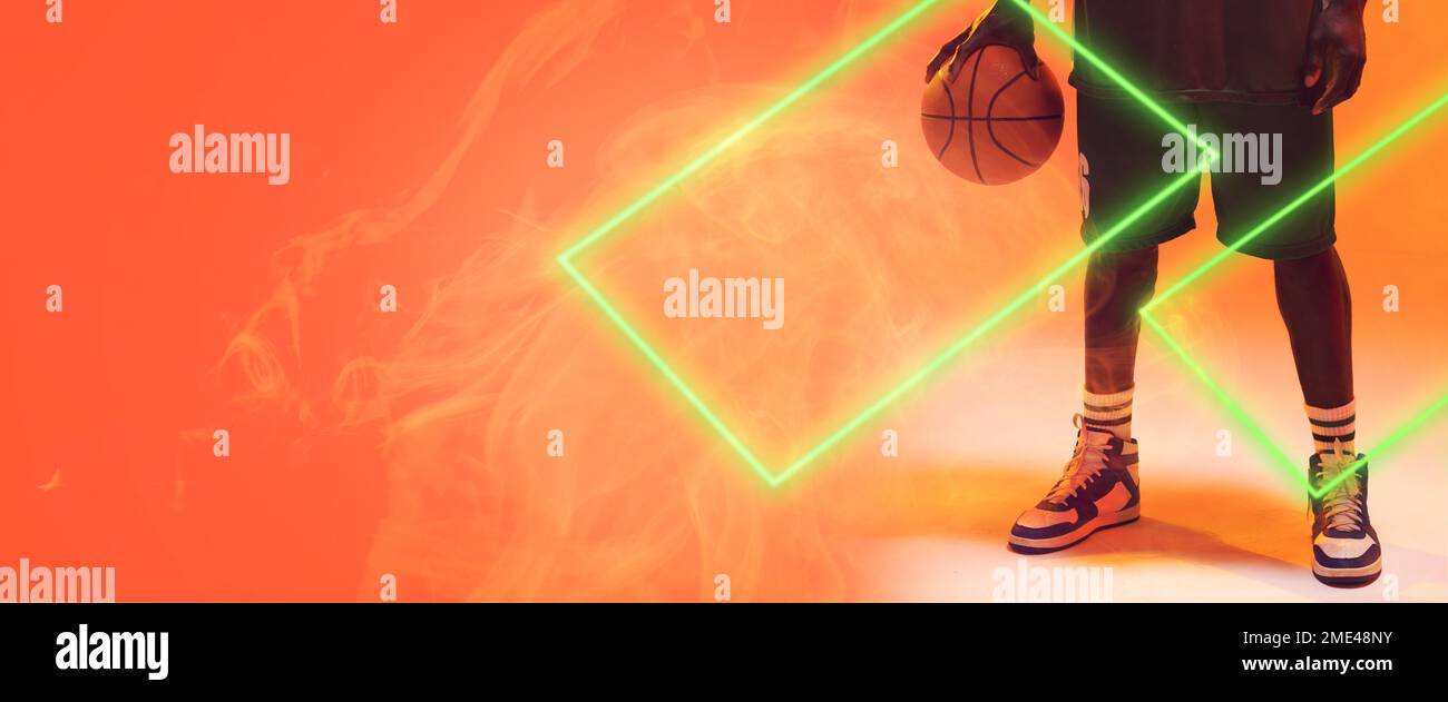 Low section of african american basketball player with ball by ...