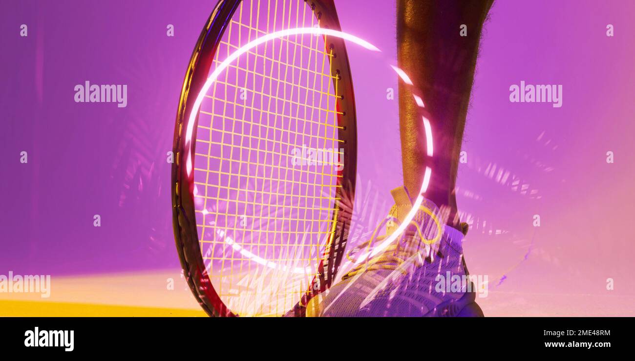 Illuminated circle and plants over cropped leg of african american male ...