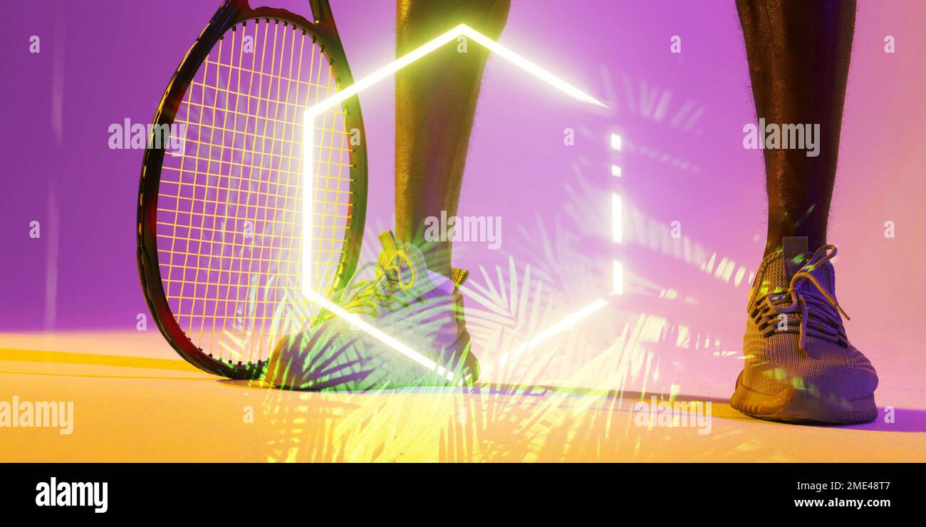 Low section of african american male player with tennis racket over ...