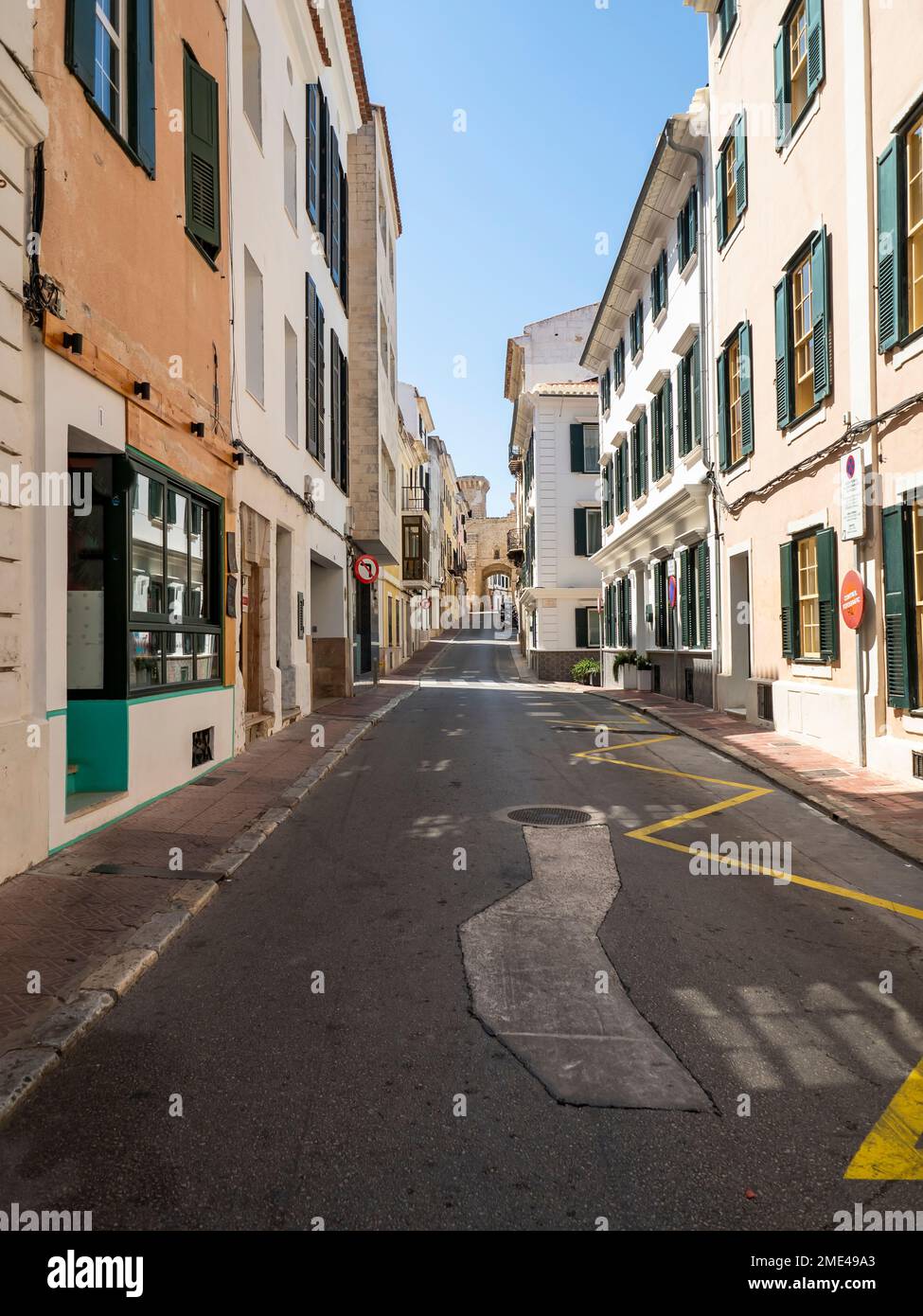 Spain, Balearic Islands, Mahon, Empty old town street in summer Stock ...