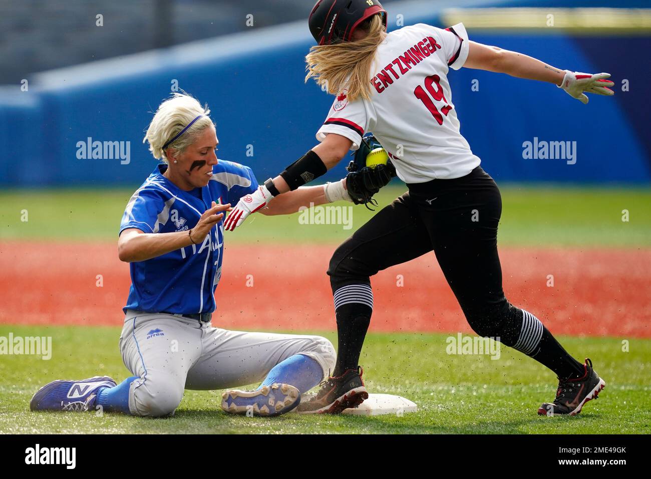 Canada's Emma Entzminger, right, steals second base past Italy's Amanda ...