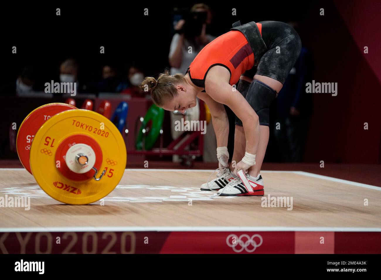 Rachel Leblanc-Bazinet of Canada removes her shoes to pay respect to ...