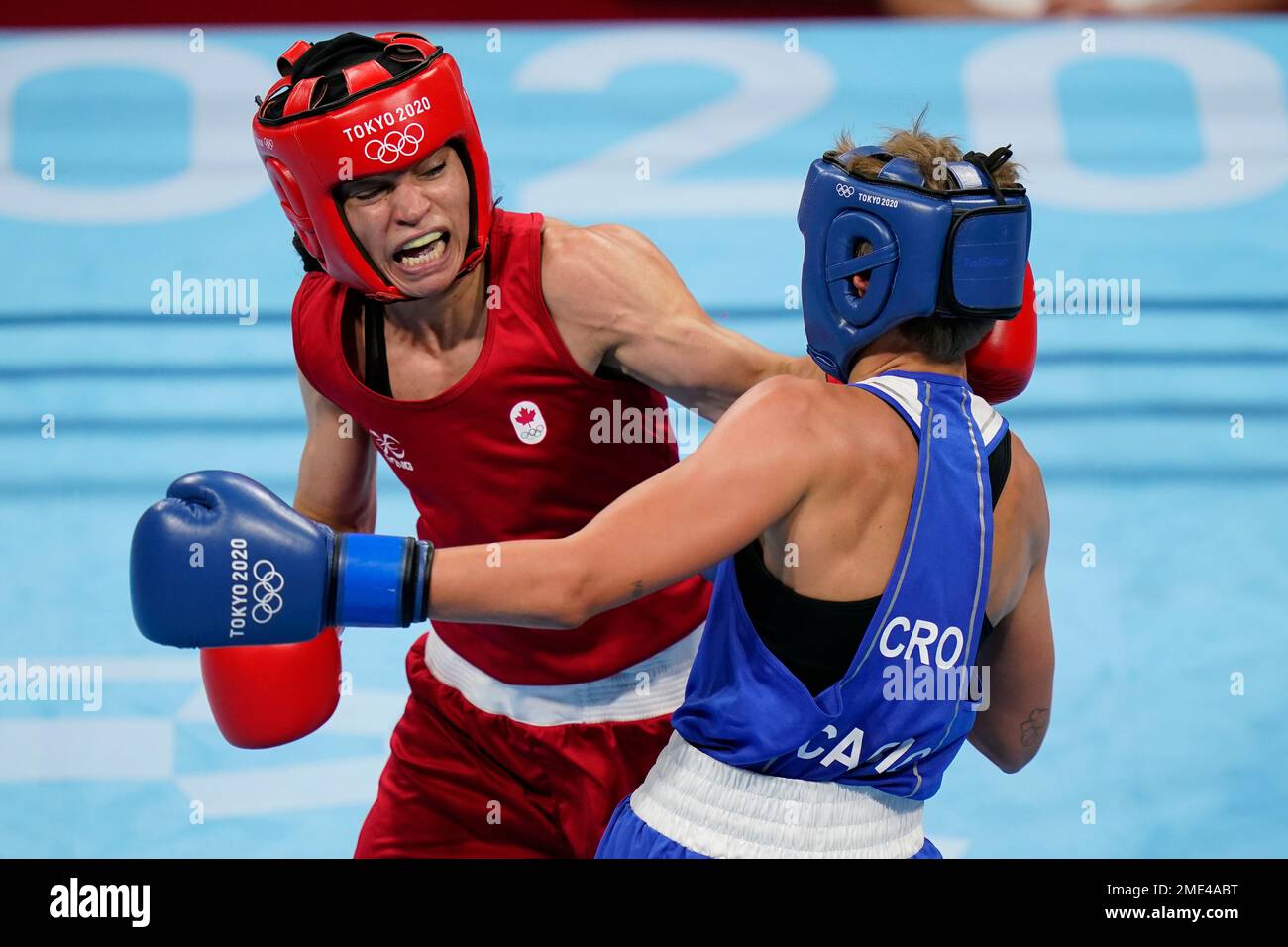 Caroline Veyre, of Canada, left, lands a shot against Croatia's ...