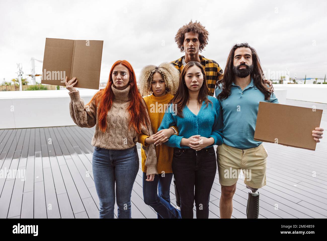 Protest activist holding placards hi-res stock photography and images ...