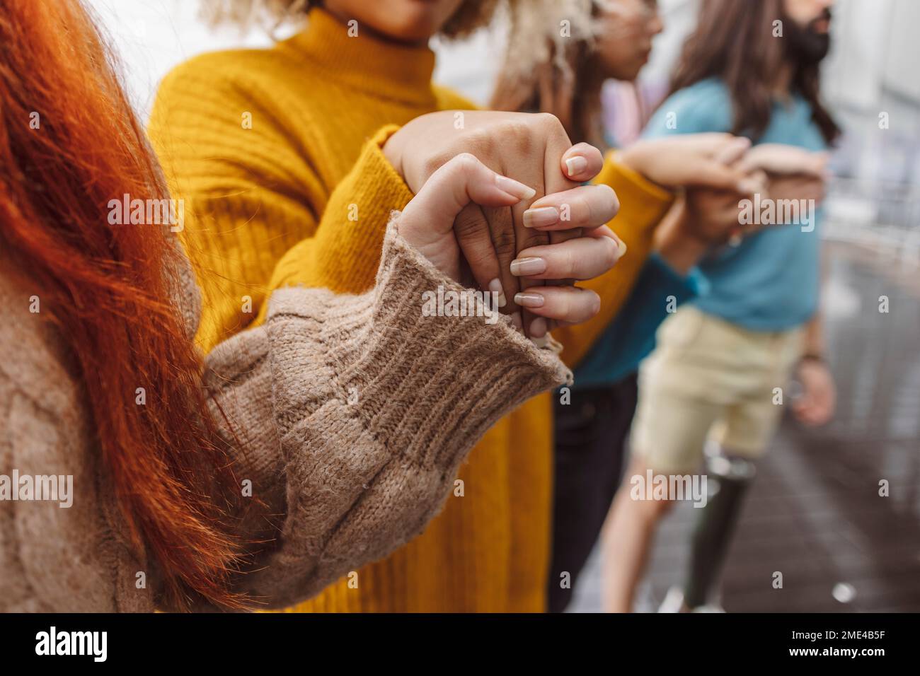 Multicultural community people holding hands hi-res stock photography ...
