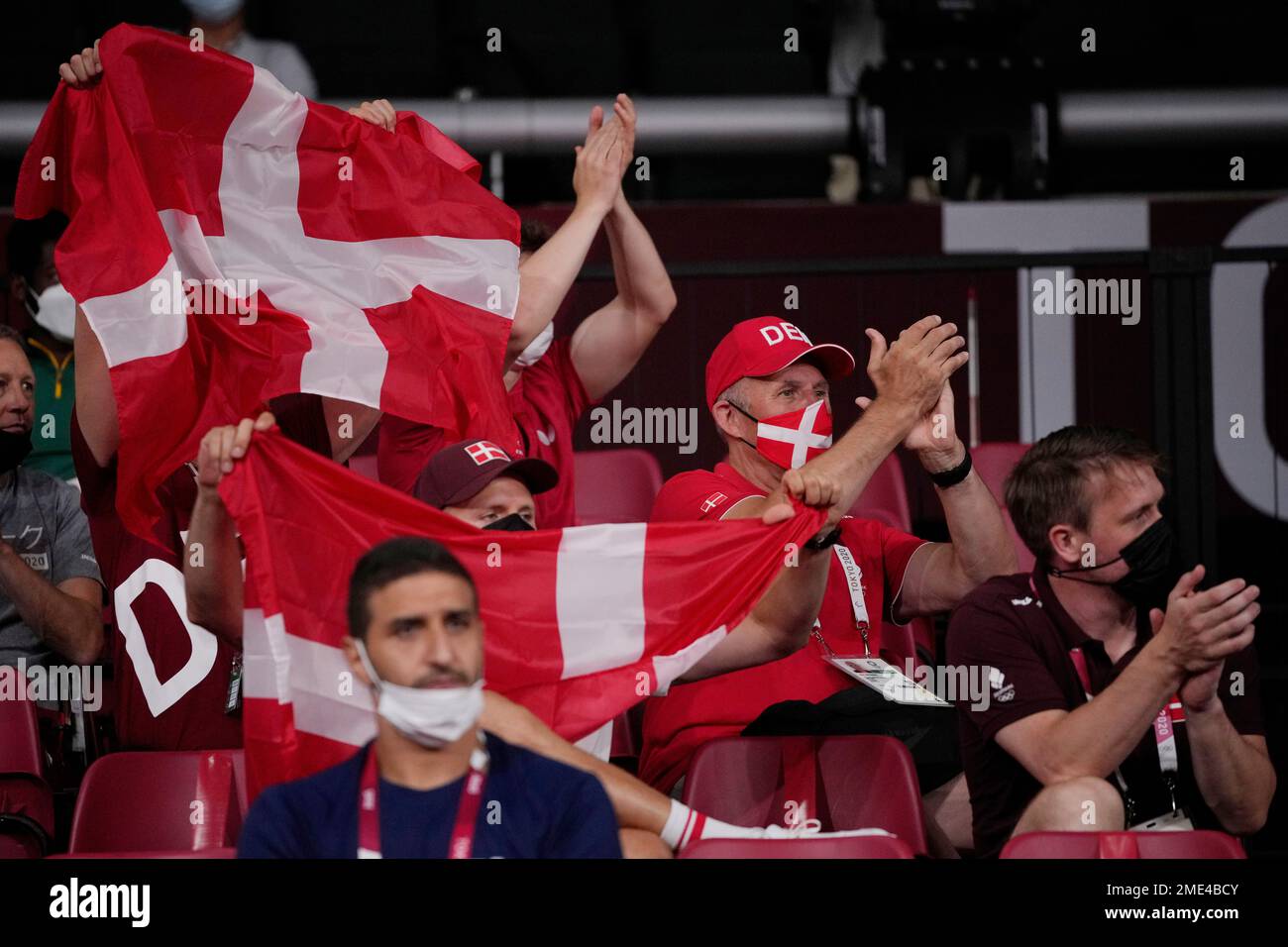 Supporters of Denmark's Jonathan Groth wave flags during the table ...