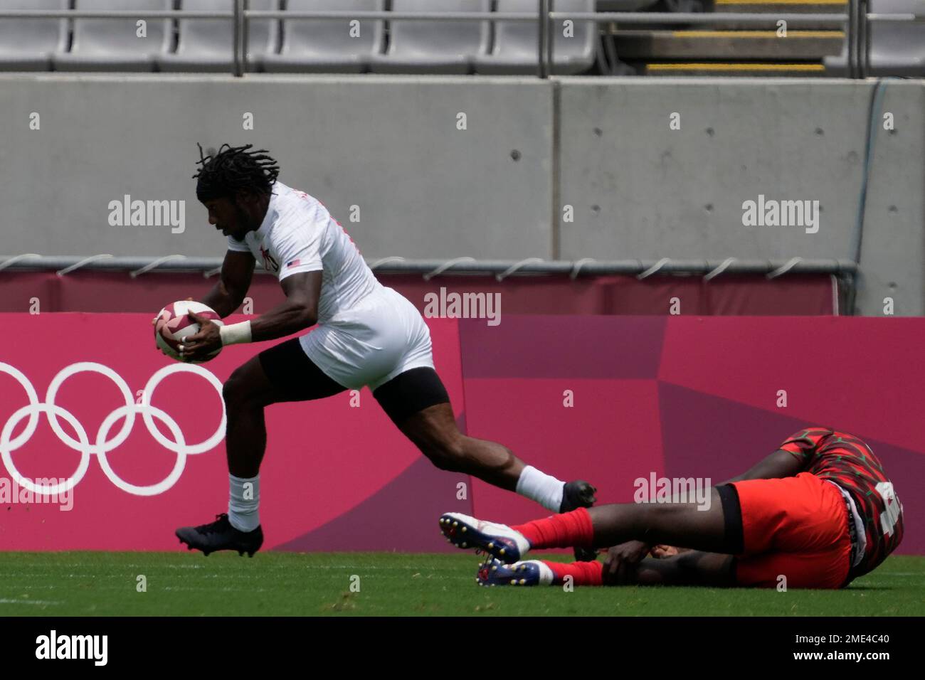 Carlin Isles of the U.S. gets past Kenya's Vincent Onyala, right, to ...