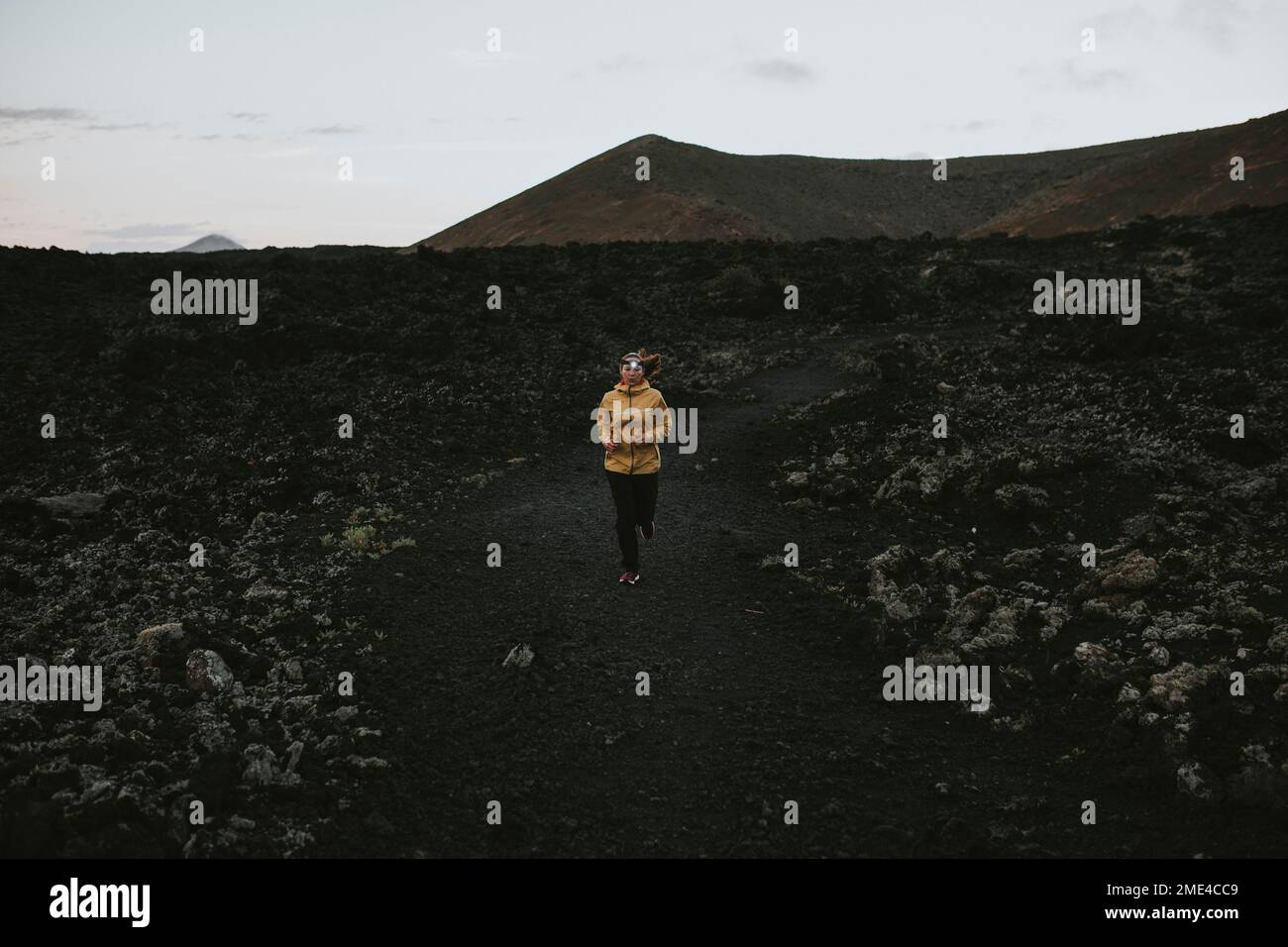 Woman running pathway volcanic landscape caldera blanca volcano hi-res ...