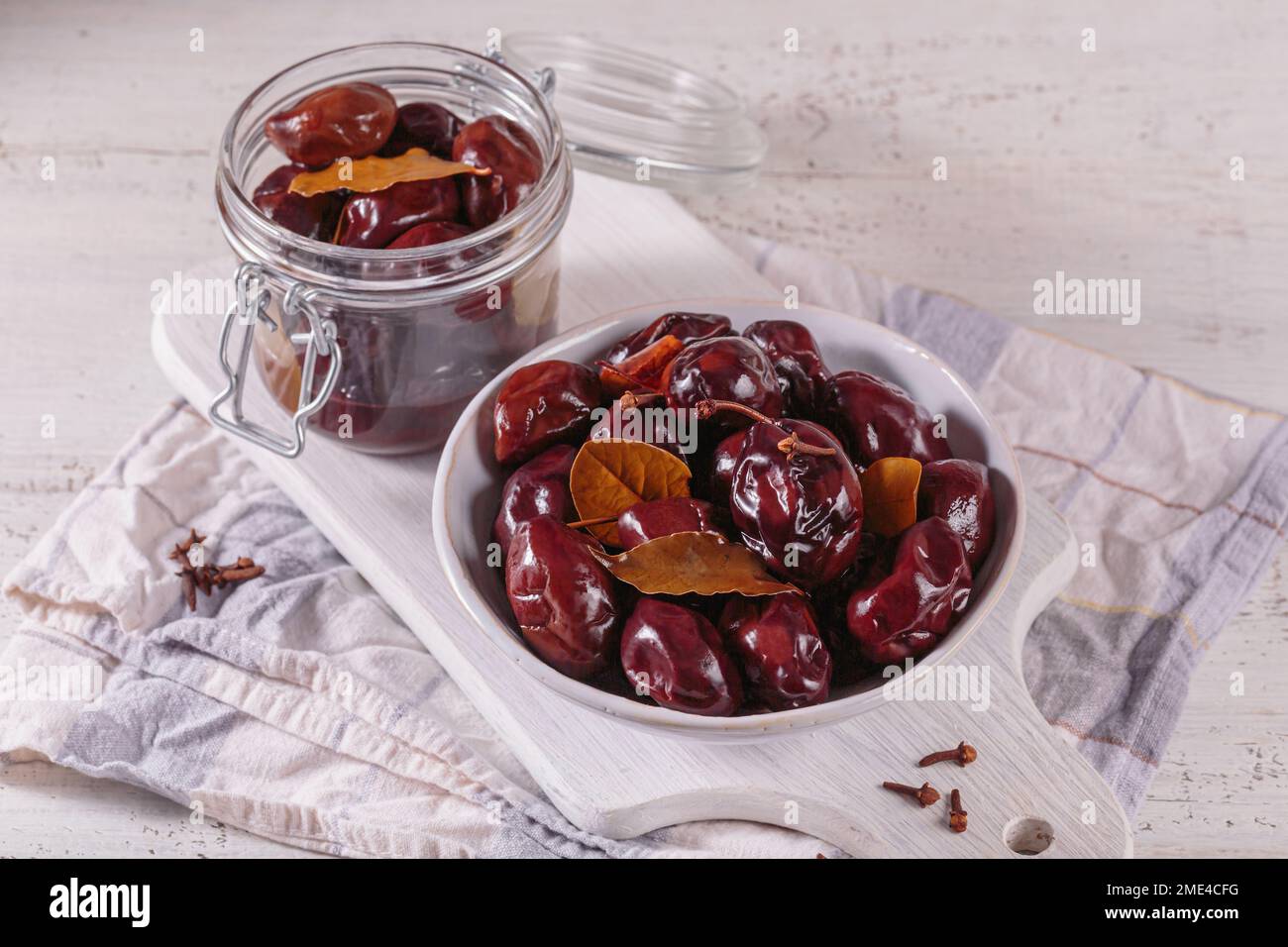 Preserving pickled plums and seasonings Stock Photo - Alamy