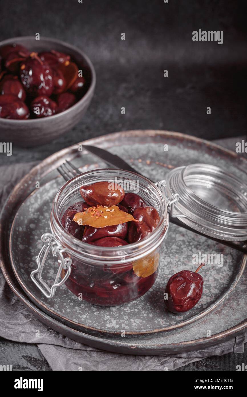 Preserving pickled plums and seasonings Stock Photo - Alamy