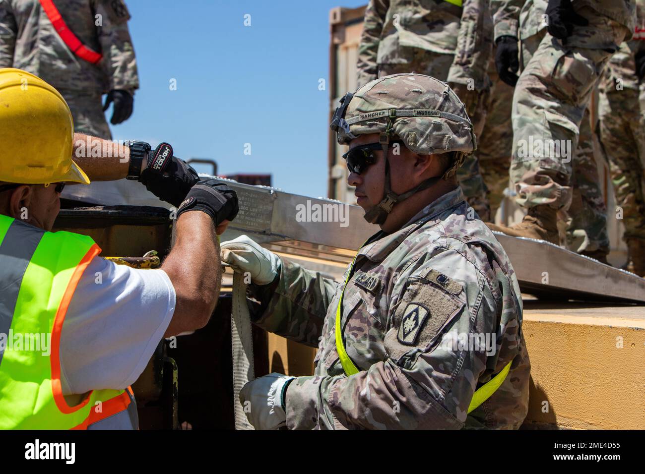 Transportation Assistant Mike Chavers, left and Spc. Mario Sanchez, a ...