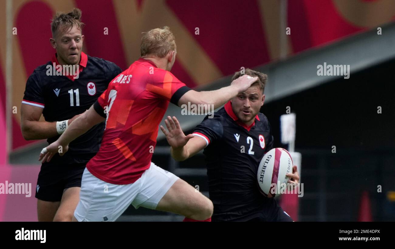 Canada's Theo Sauder, right, is pursued by Great Britain's Alec Coombes ...
