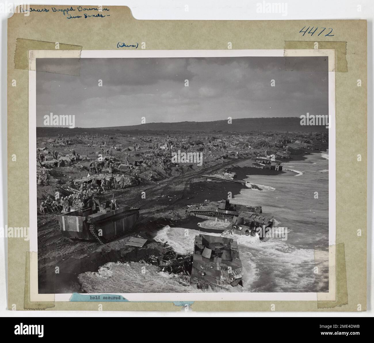 This image depicts U.S. Coast Guard-manned Amtracs trapped in the sands ...