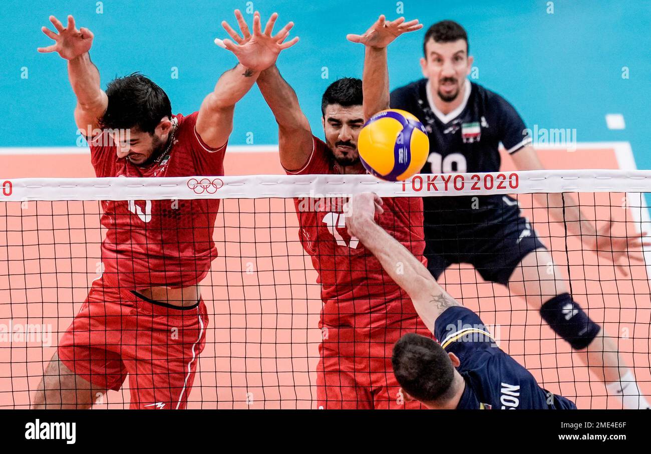 Iran's Aliasghar Mojarad, left, and Iran's Meisam Salehi block a ball ...