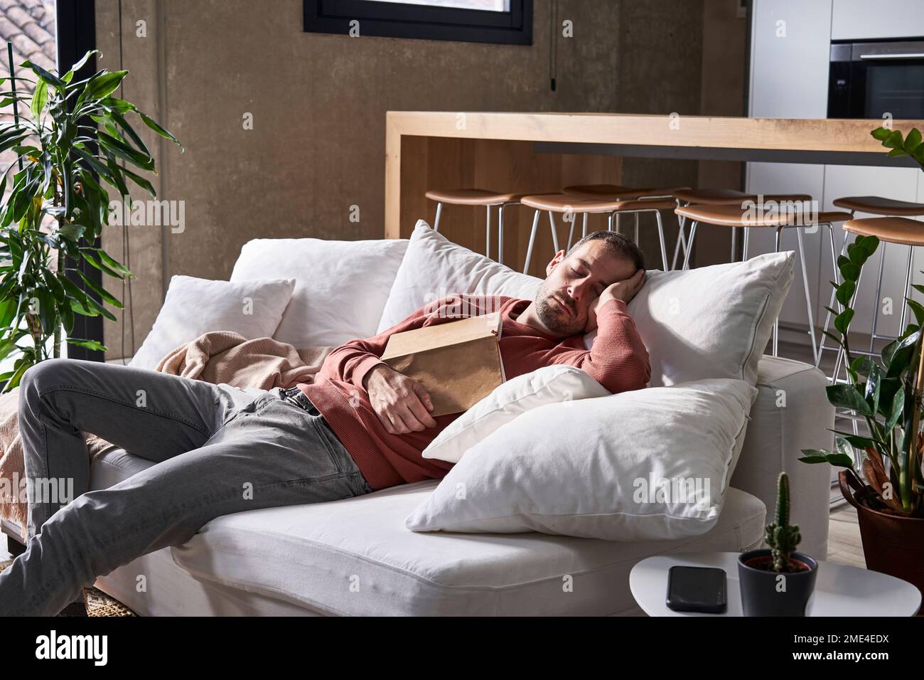 Man book sleeping on sofa hi-res stock photography and images - Alamy