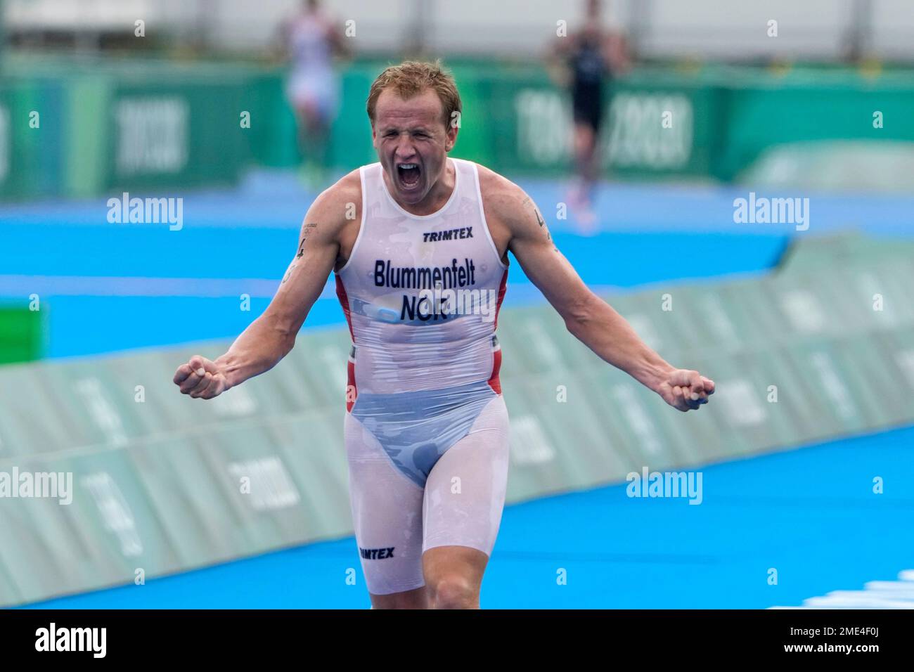 Kristian Blummenfelt of Norway celebrates as he approaches the finish ...
