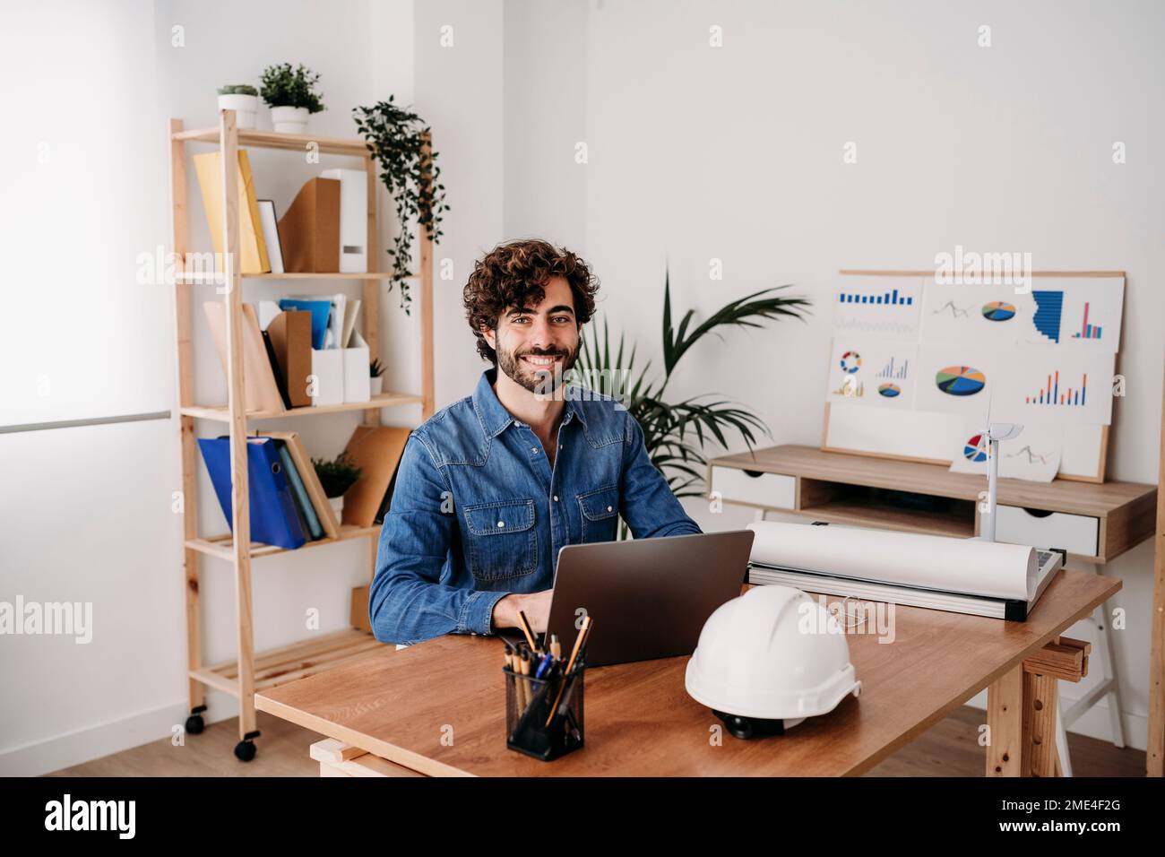 Engineer working desk laptop helmet hi-res stock photography and images ...