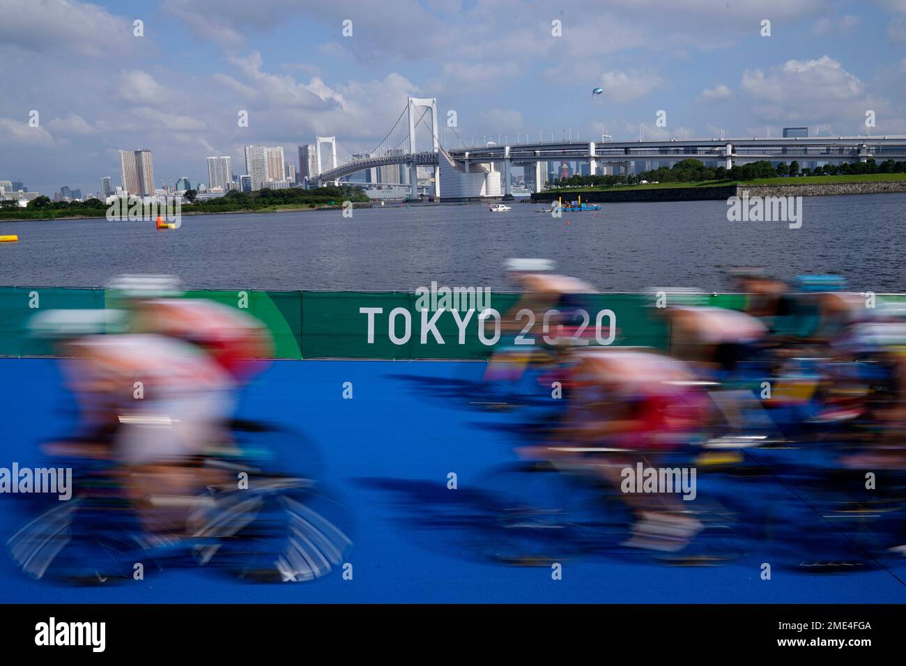 Athletes appear as a blur in this slow shutter speed photo, as they ...