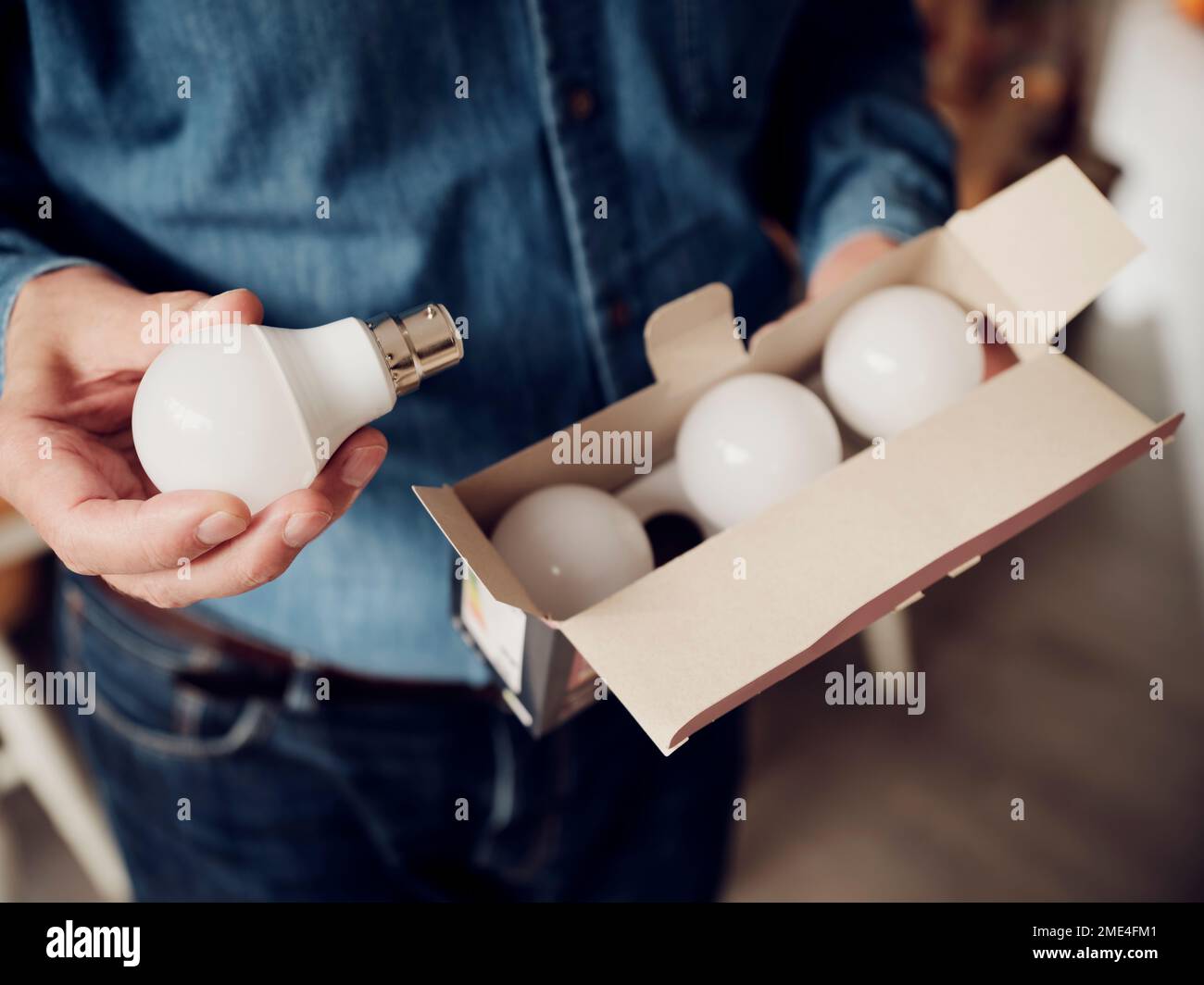 Man holding up a box hi-res stock photography and images - Alamy