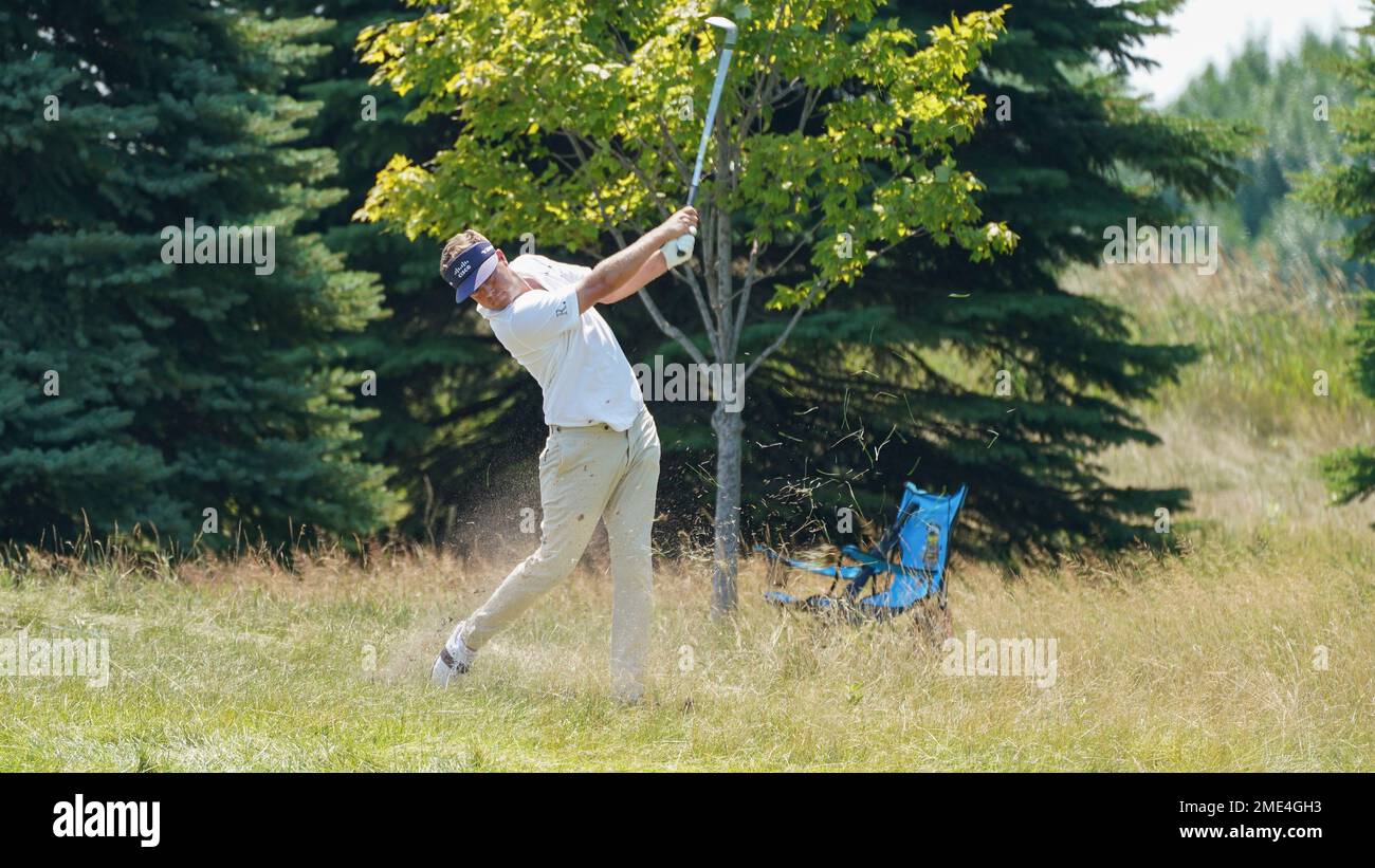 Keith Mitchell hits out of the rough on the eighth hole during the ...