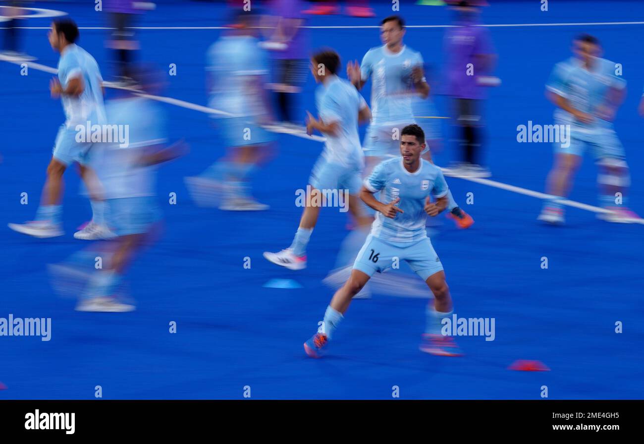 Argentina players warm up before a men's field hockey match against ...
