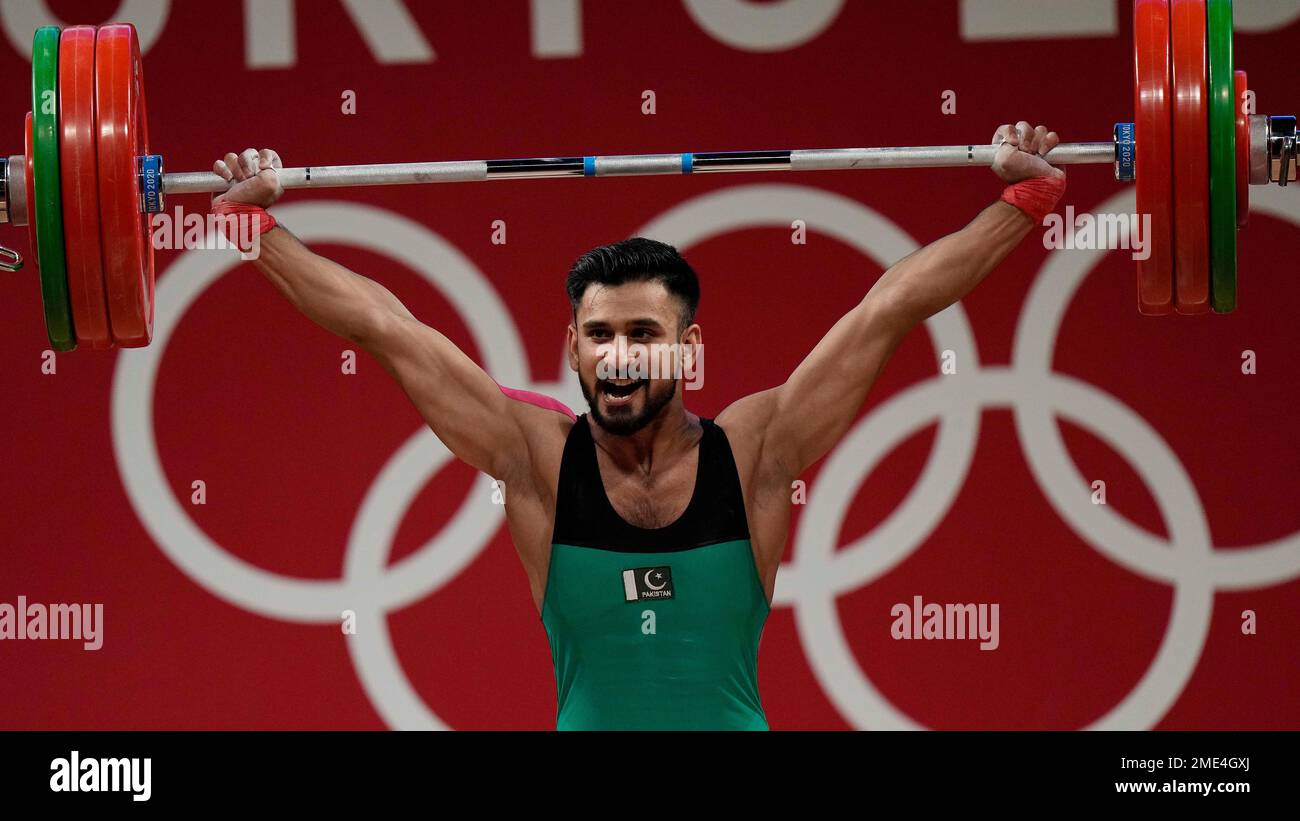 Talha Talib of Pakistan competes in the men's 67kg weightlifting event ...