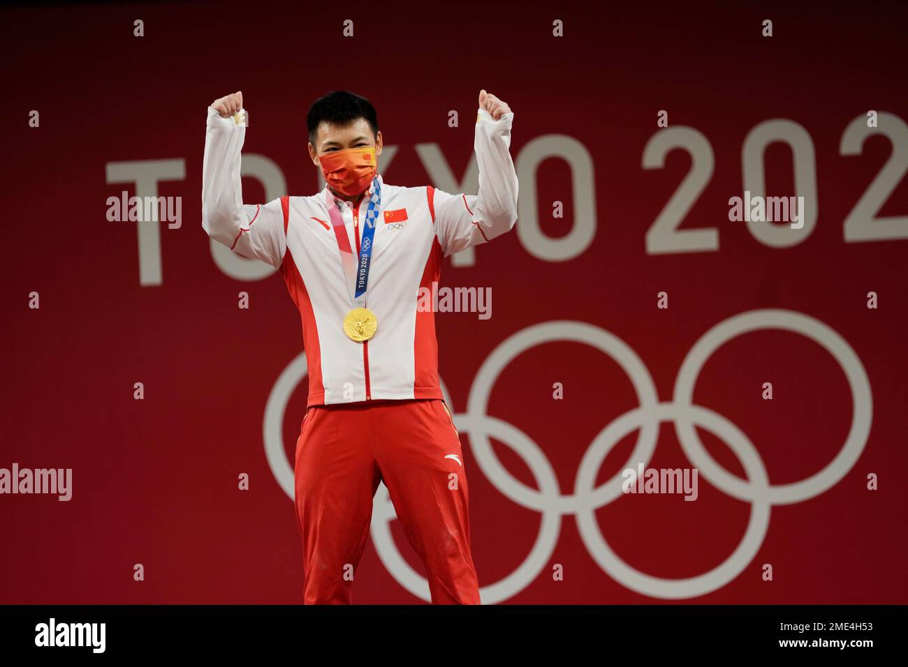 Chen Lijun of China celebrates on the podium after winning the gold ...