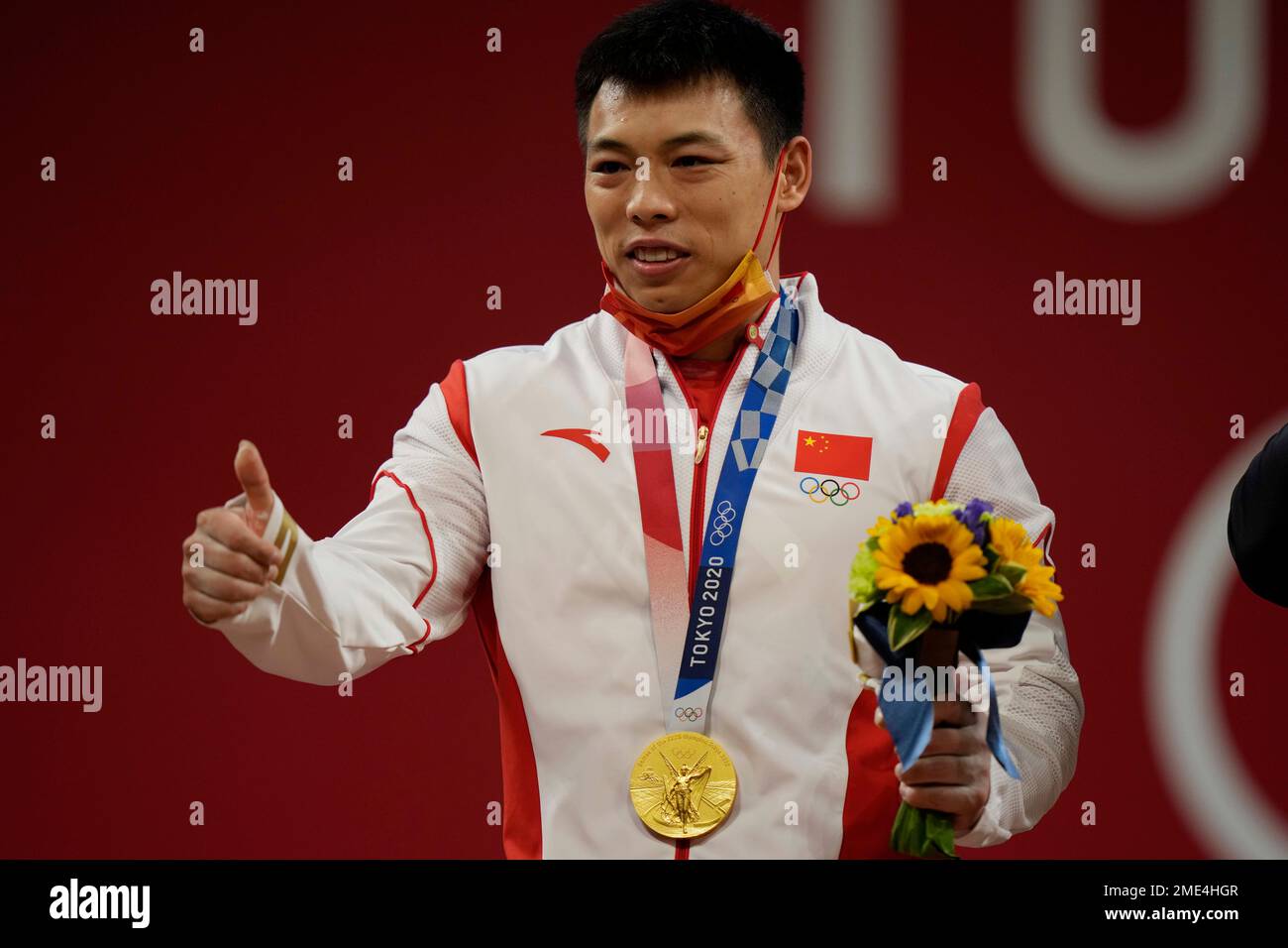 Chen Lijun of China celebrates on the podium after winning the gold ...
