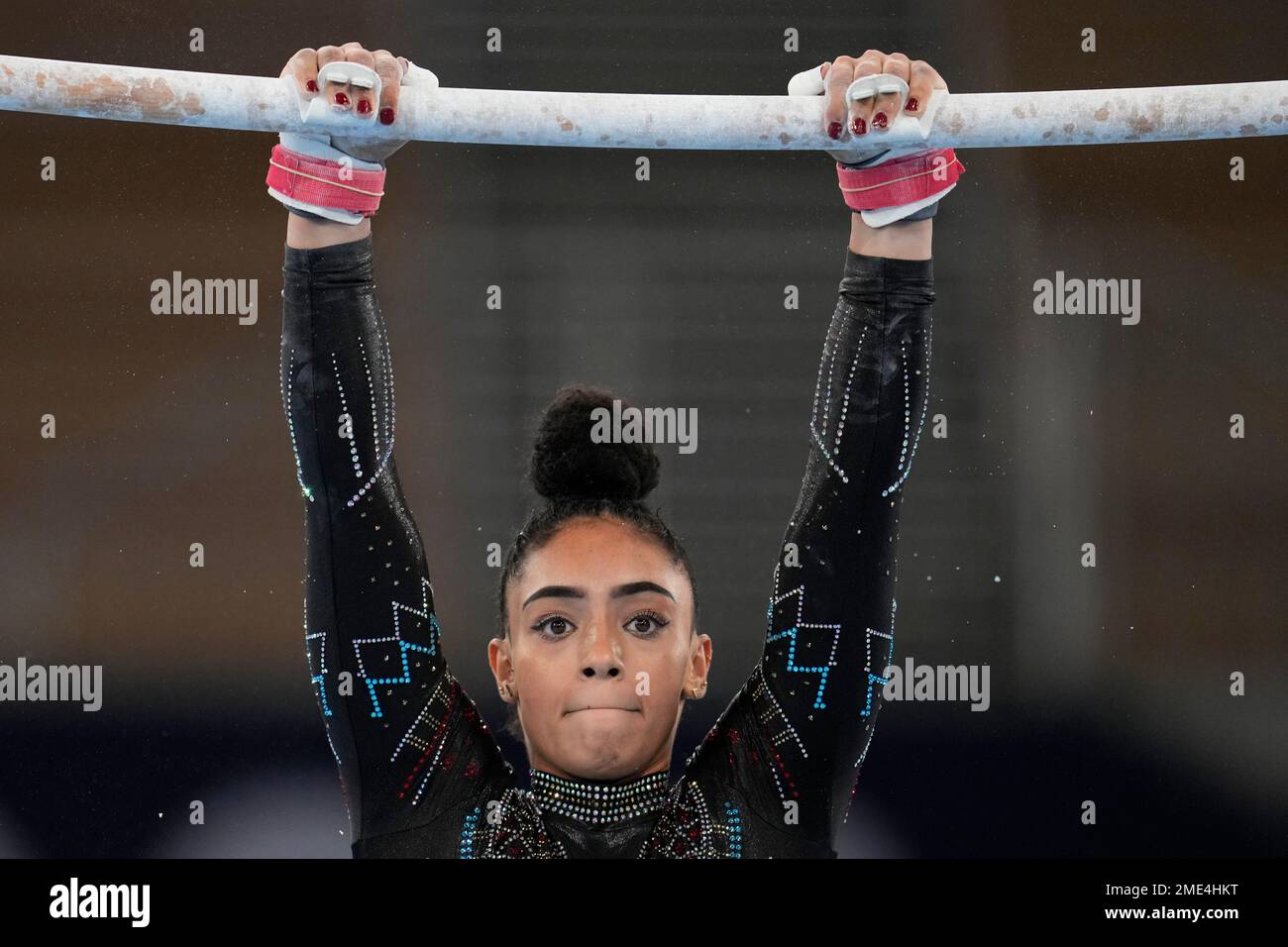Mandy Mohamed, of Egypt, performs on the uneven bars during the women's ...