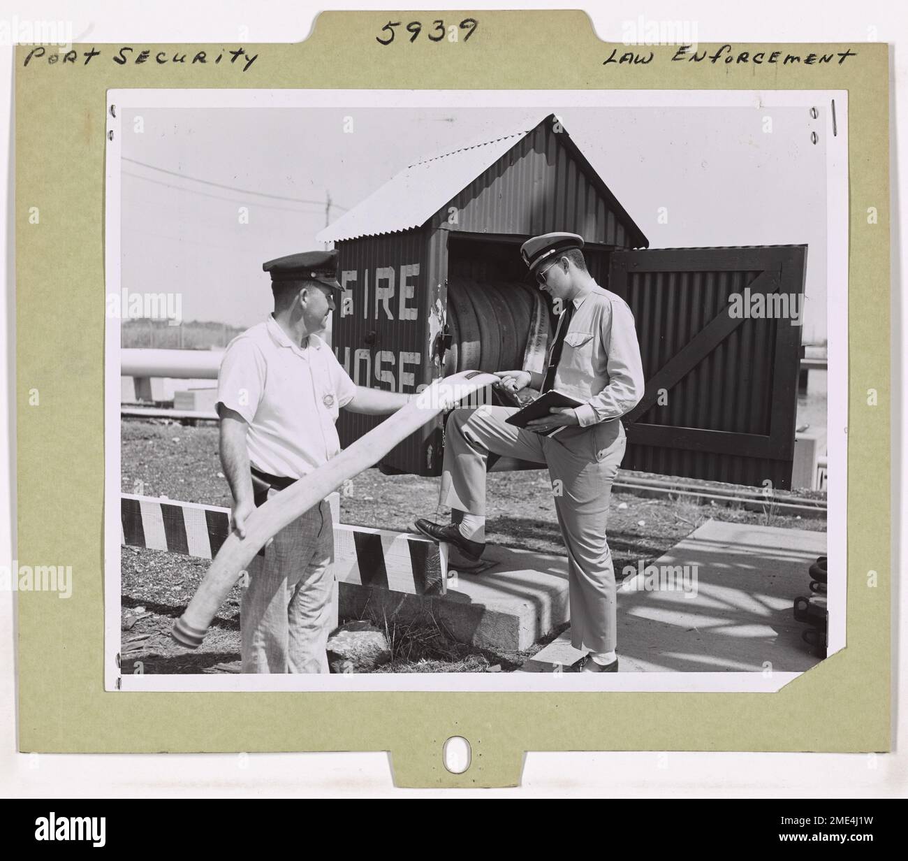 A Coast Guardsman inspects firefighting equipment at the Port of ...