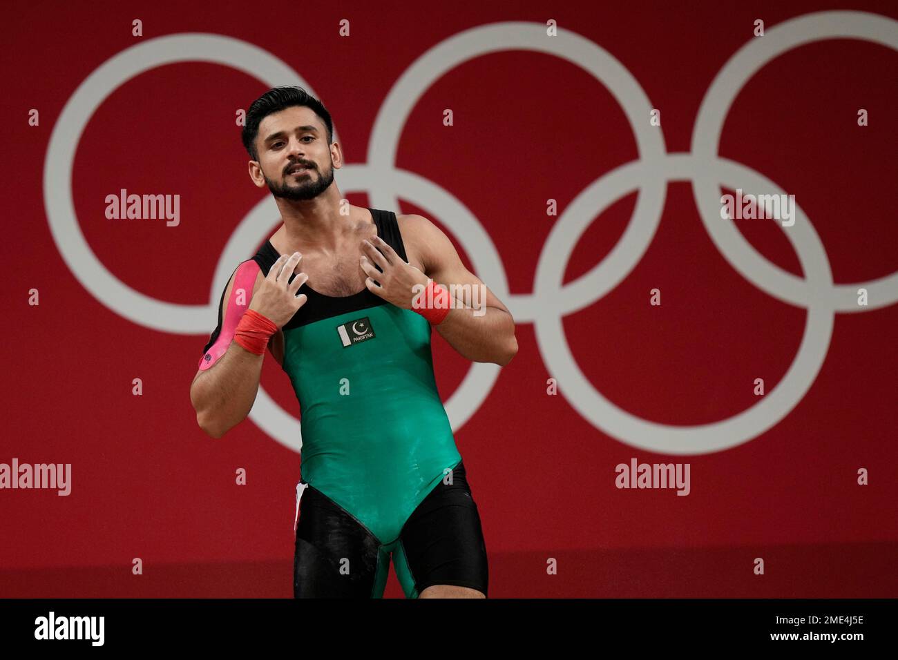 Talha Talib of Pakistan celebrates after a lift as he competes in the ...