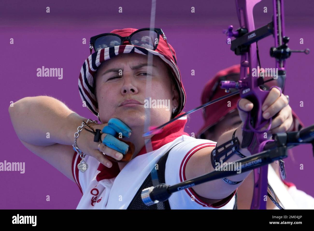Ksenia Perova of the Russian Olympic Committee releases an arrow during the women's team ...