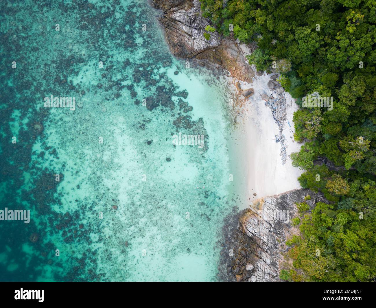 An top view of Galah Beach with green trees on Ko Lipe island in ...
