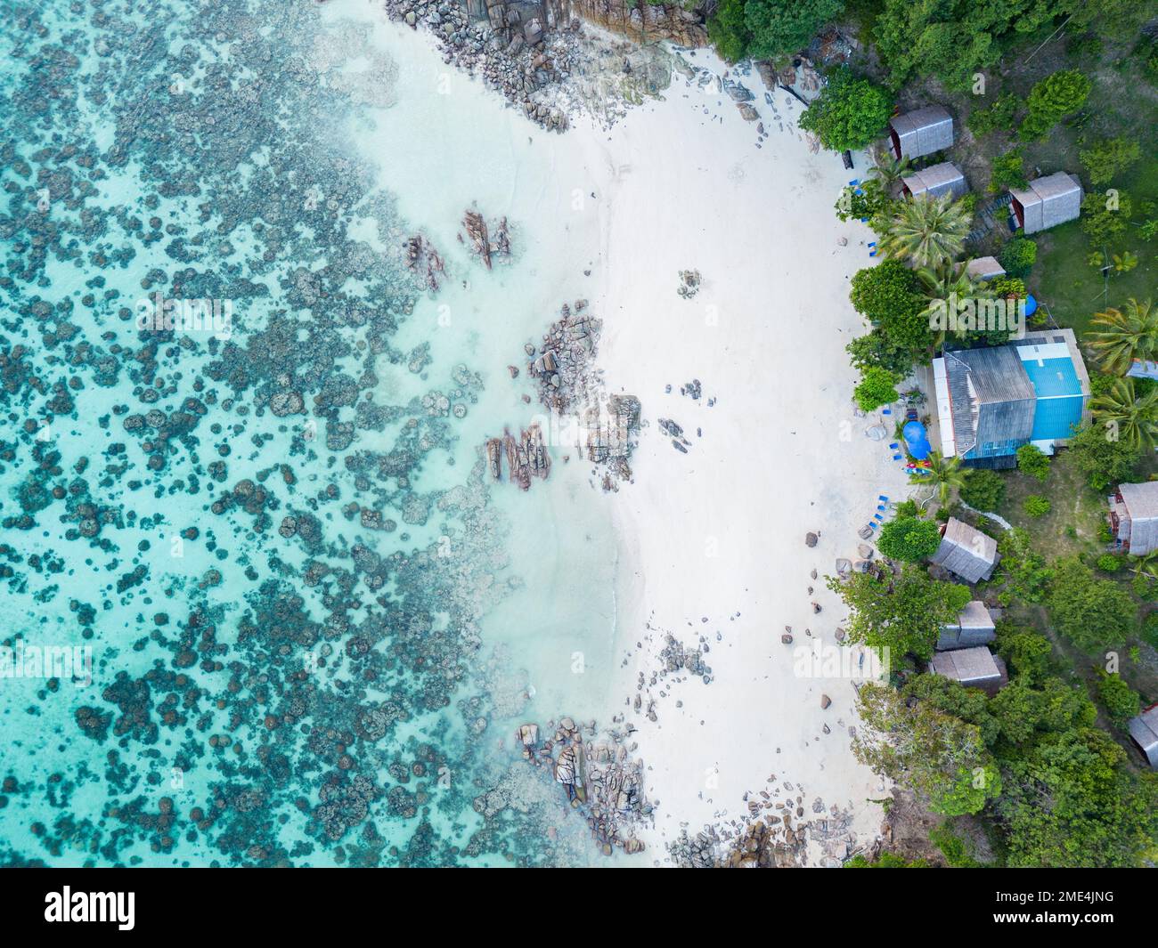 An top view of Sanom Beach with green trees on Ko Lipe island in ...