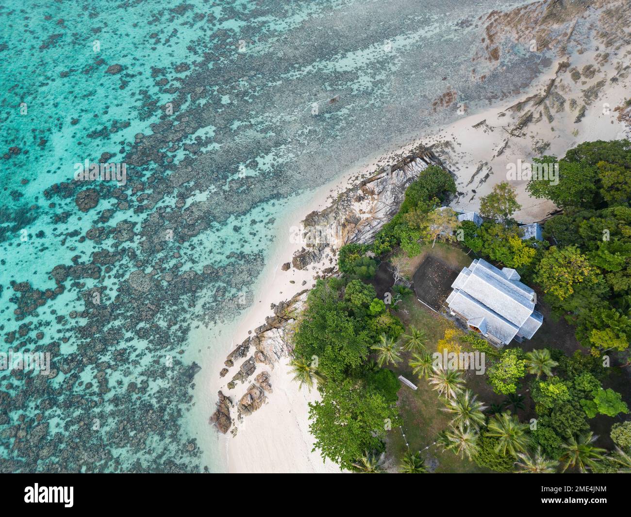 An aerial of the Sunset Beach with green trees on Ko Lipe island in ...