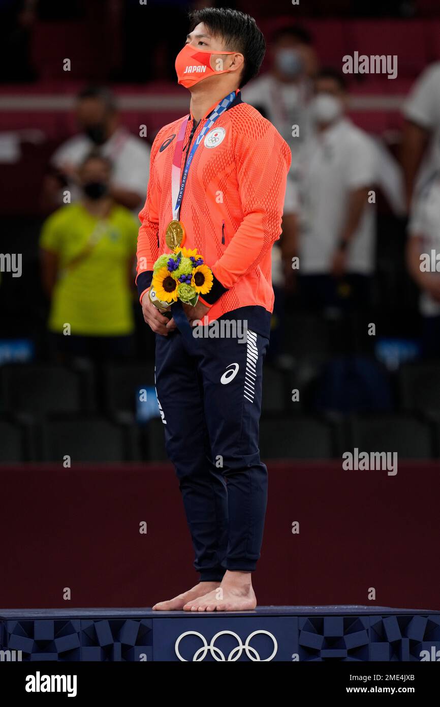 Gold medalist Hifumi Abe of Japan stands during the medal ceremony for ...