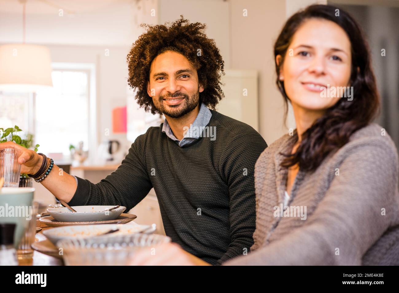 Happy caucasian man sitting table hi-res stock photography and images ...
