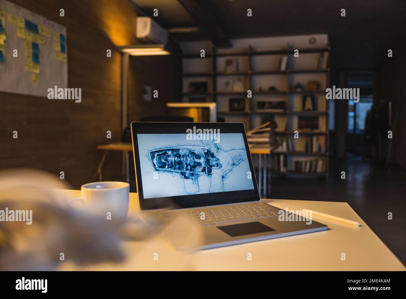 Laptop with wind turbine design kept on desk Stock Photo - Alamy